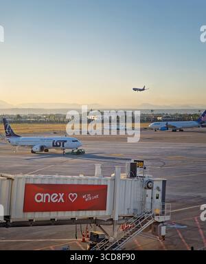 Airplane parked at the air bridge on a clear sunny day Stock Photo - Alamy