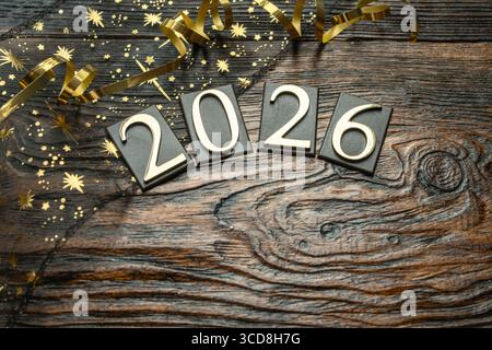 January 2026 Calendar on Wooden Desk. Vintage books, pencils and a ...
