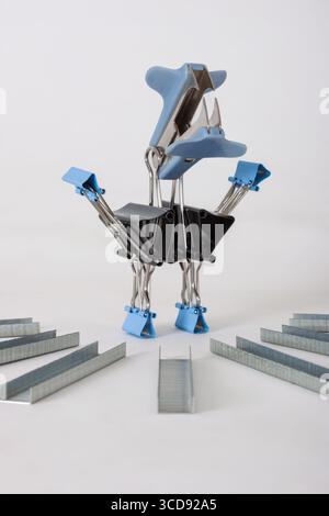 Metal staples on color background Stock Photo - Alamy