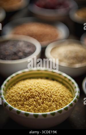 Bowl of raw couscous on table Stock Photo - Alamy