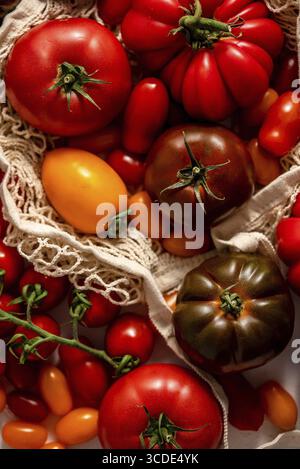Tomatoes on the table. Tomatoes of different varieties Stock Photo - Alamy