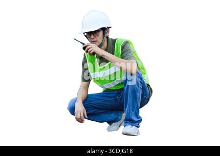 Male engineer using radio, isolated on white background Stock Photo - Alamy