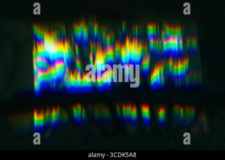 Colorful spectral patterns created by refraction of light through a ...