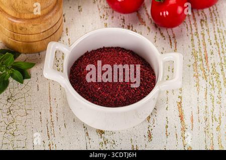 Natural organic Sumah powder for culinary in the bowl Stock Photo - Alamy