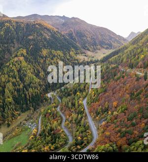 Road Winding Through Towering Red Sandstone Canyon Walls in Utah Stock ...