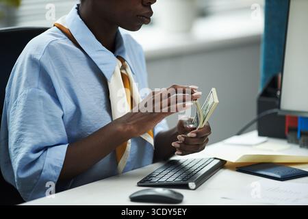Female hands counting money near laptop at the desk Stock Photo - Alamy