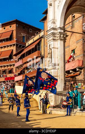 Men From The Nicchio (Shell) Contrada Arrive In The Piazza With Their ...