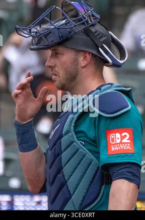 Seattle Mariners catcher Mitch Garver plays with his kids before a ...