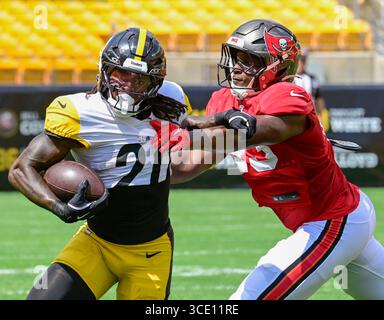 Pittsburgh Steelers running back Kaleb Johnson (20) runs onto the field ...
