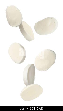 Mozzarella cheese pieces falling against white background Stock Photo ...