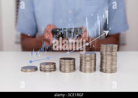Stack coin and smartphone on table with statistic graph diagram Stock ...