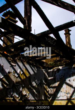 The wall, ceiling and roof of a damaged wooden pavilion are under ...