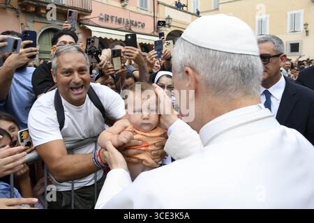 Pope Leo XIV is greeted by faithful during the weekly general audience ...