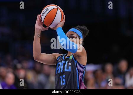 Atlanta Dream guard Allisha Gray, left, looks to shoot over Indiana ...