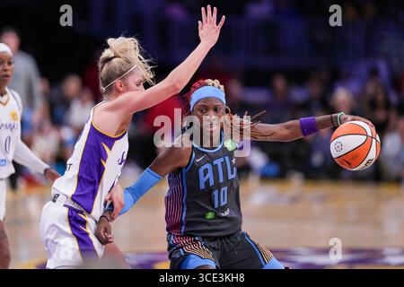 Atlanta Dream guard Rhyne Howard, left, fouls Indiana Fever center ...