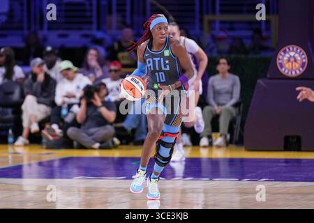 Atlanta Dream guard Rhyne Howard, left, fouls Indiana Fever center ...