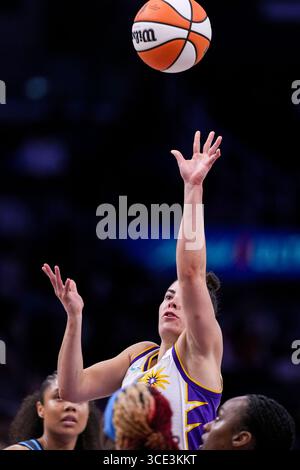 LA Sparks guard Kelsey Plum (10] chats with referee Angel Kent during ...