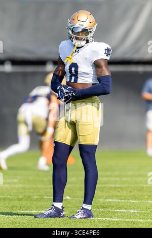 Notre Dame safety Adon Shuler, center, returns an interception for a ...