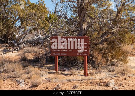 Painted wooden sign with Mesa Trails distances in the Natural Bridges ...