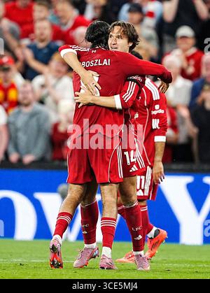 Liverpool's Federico Chiesa (right) celebrates scoring their side's ...