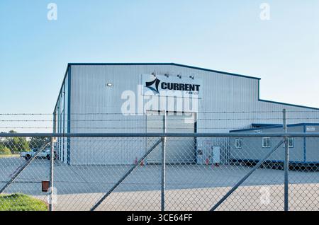 People in front of a secured fence. USA flag behind Stock Photo - Alamy