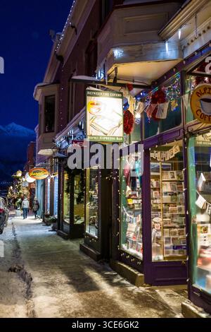 Illuminated storefront windows along Historic Colorado Avenue in ...