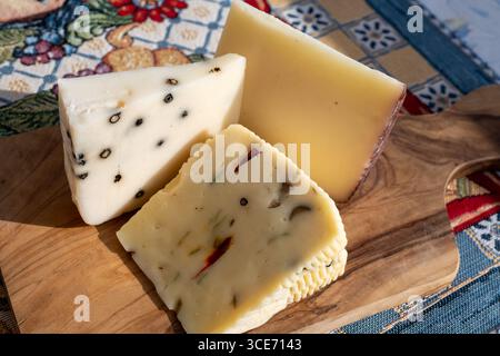 Sicilian fresh organic black pecorino cheese Stock Photo - Alamy