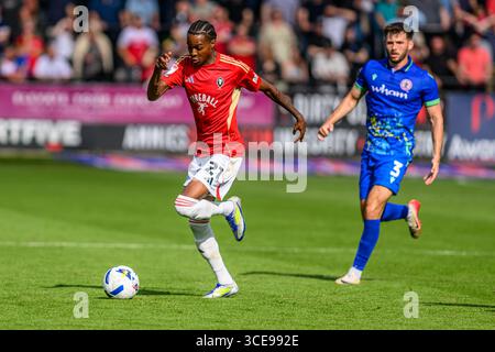 Kallum Cesay of Salford City FC under pressure from Freddy Willcox and ...