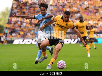 Wolverhampton Wanderers' Andre (left) and Manchester United's Kobbie ...