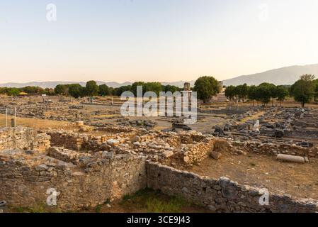 Wide panoramic view of archaeological ruins and grassy field at ...