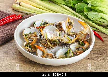 Delicous Asian mollusk shell steamed with spices Stock Photo - Alamy