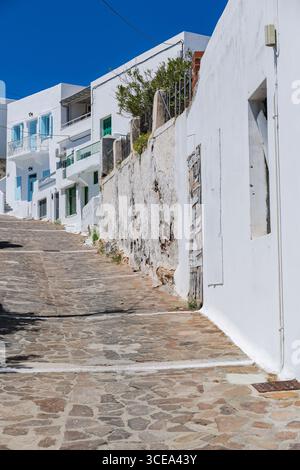 A street with traditional architecture and painted white in the village ...