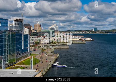 People walking on the Halifax Waterfront Boardwalk, Halifax Harbour ...