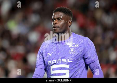 Rennes goalkeeper Brice Samba, Jean-Philippe Krasso of Paris FC during ...
