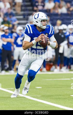 Indianapolis Colts quarterback Riley Leonard (15) runs onto the field ...