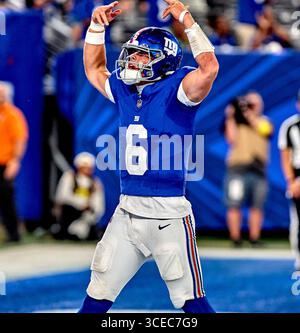 New York Giants quarterback Jaxson Dart (6) reacts after scoring a touchdown against the Los ...