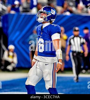 New York Giants quarterback Jaxson Dart, left, talks with his mother ...
