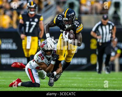 Tampa Bay Buccaneers cornerback Jacob Parrish (25) tackles Miami ...