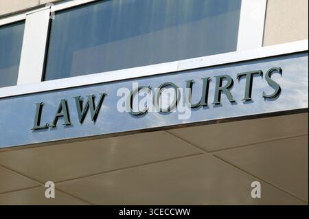 Law courts sign positioned above the entrance of a courthouse, stock ...