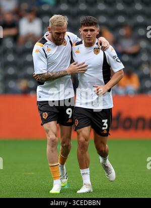 Hull City's Oliver McBurnie (left) celebrates with Liam Millar after ...