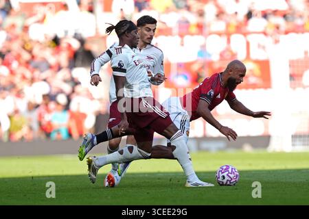 Manchester United's Bryan Mbeumo (centre right) and Nottingham Forest's ...