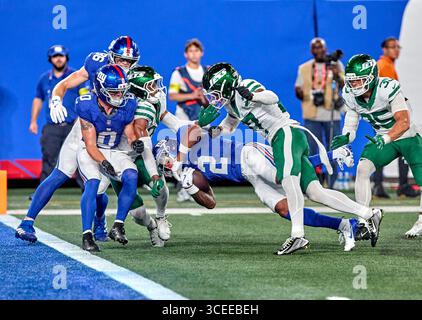 New York Jets safety Malachi Moore (27) shoves Tampa Bay Buccaneers ...