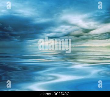 Clouds above a calm sea Stock Photo - Alamy