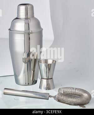 Cosmetic bottle in silver spoon on yellow background Stock Photo - Alamy