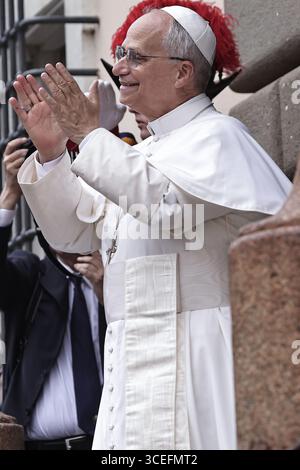 Pope Leo XIV leads the Angelus prayer from the window of the Apostolic ...