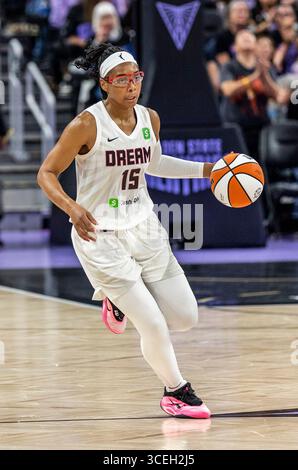 Atlanta Dream guard Allisha Gray, left, looks to shoot over Indiana ...