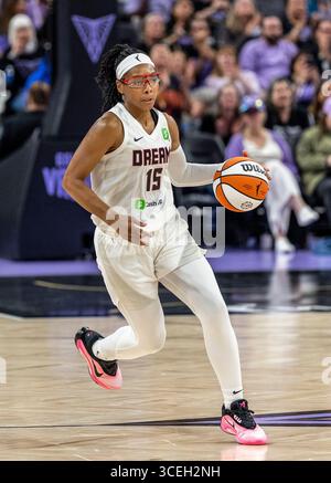 Atlanta Dream guard Allisha Gray, left, looks to shoot over Indiana ...