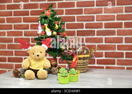 Christmas tree ornament and cupcake with snowman Stock Photo - Alamy