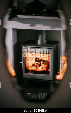 A vertical shot of orange and yellow burning fire in the dark Stock ...