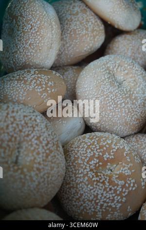 Close up of sesame coated cookies arranged in rows on tray. Concept of ...